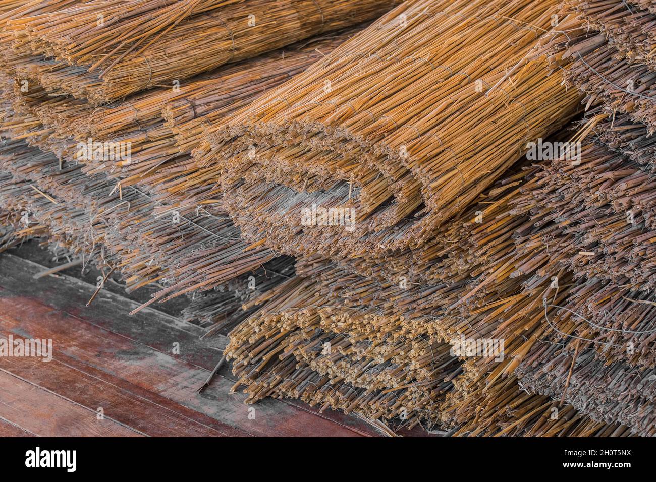 Straw rope dry reed natural material is stored in rolls Stock Photo - Alamy