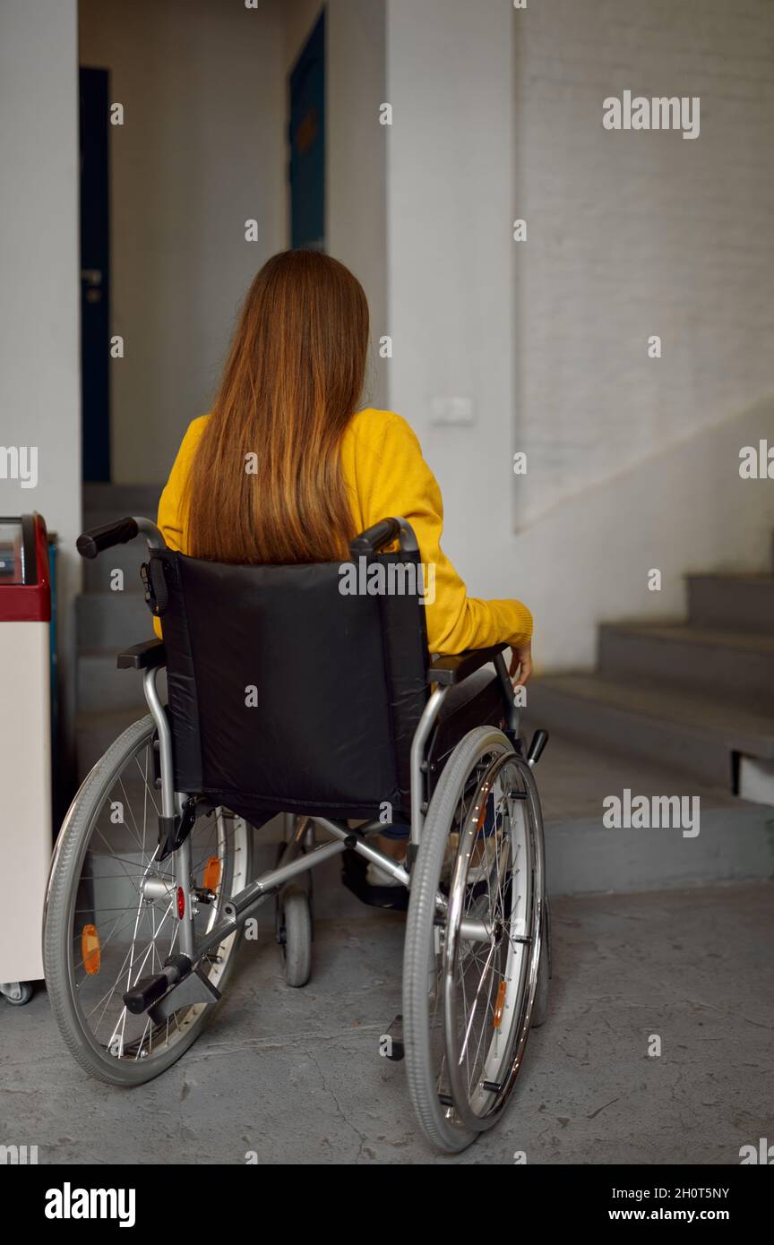 Disabled female student in wheelchair at stairs Stock Photo - Alamy