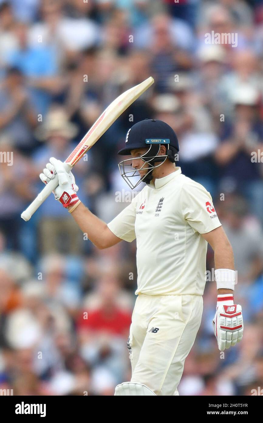 England's Joe Root celebrates scoring 50 not out during the first day ...