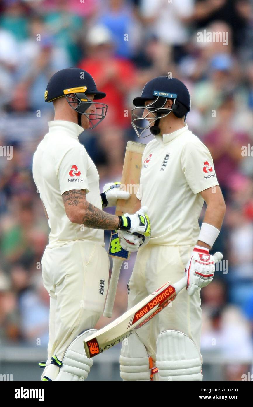 England's Ben Stokes congratulates Joe Root (right) after Root scored ...