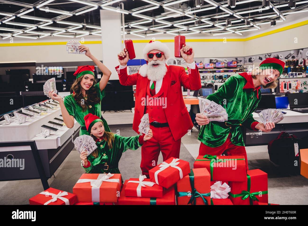 Portrait of attractive cheerful funky rich group elfs spending usd ...