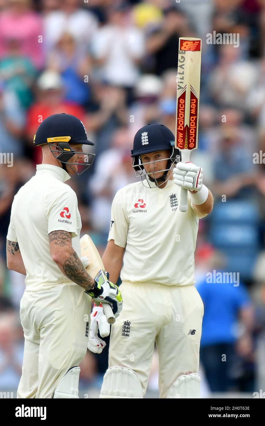 England's Joe Root (right) celebrates scoring 50 not out during the ...