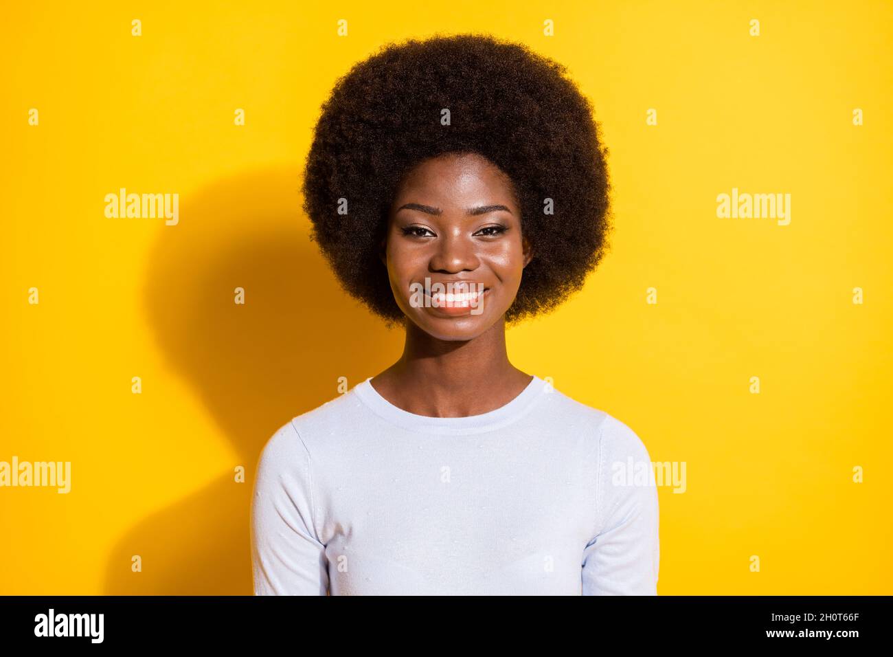 Photo of charming wavy hairdo dark skin person toothy smile look camera ...