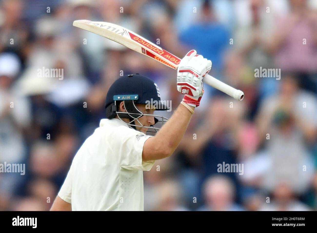 England's Joe Root celebrates scoring 50 not out during the first day ...