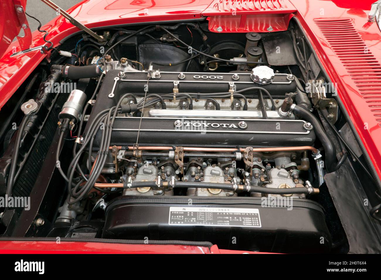 Close-up of the engine of a Red, 1967, Toyota 2000 GT, on display at ...