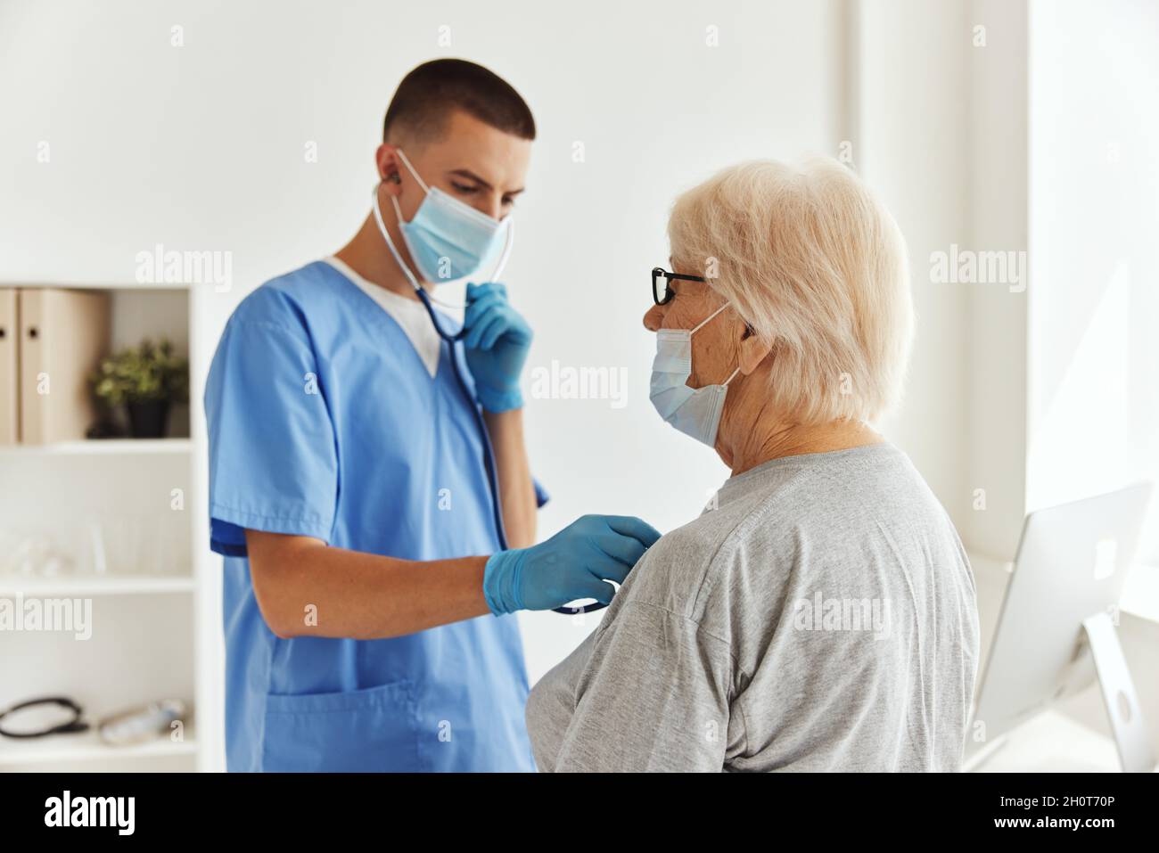Medical worker examine sick mature hi-res stock photography and images ...