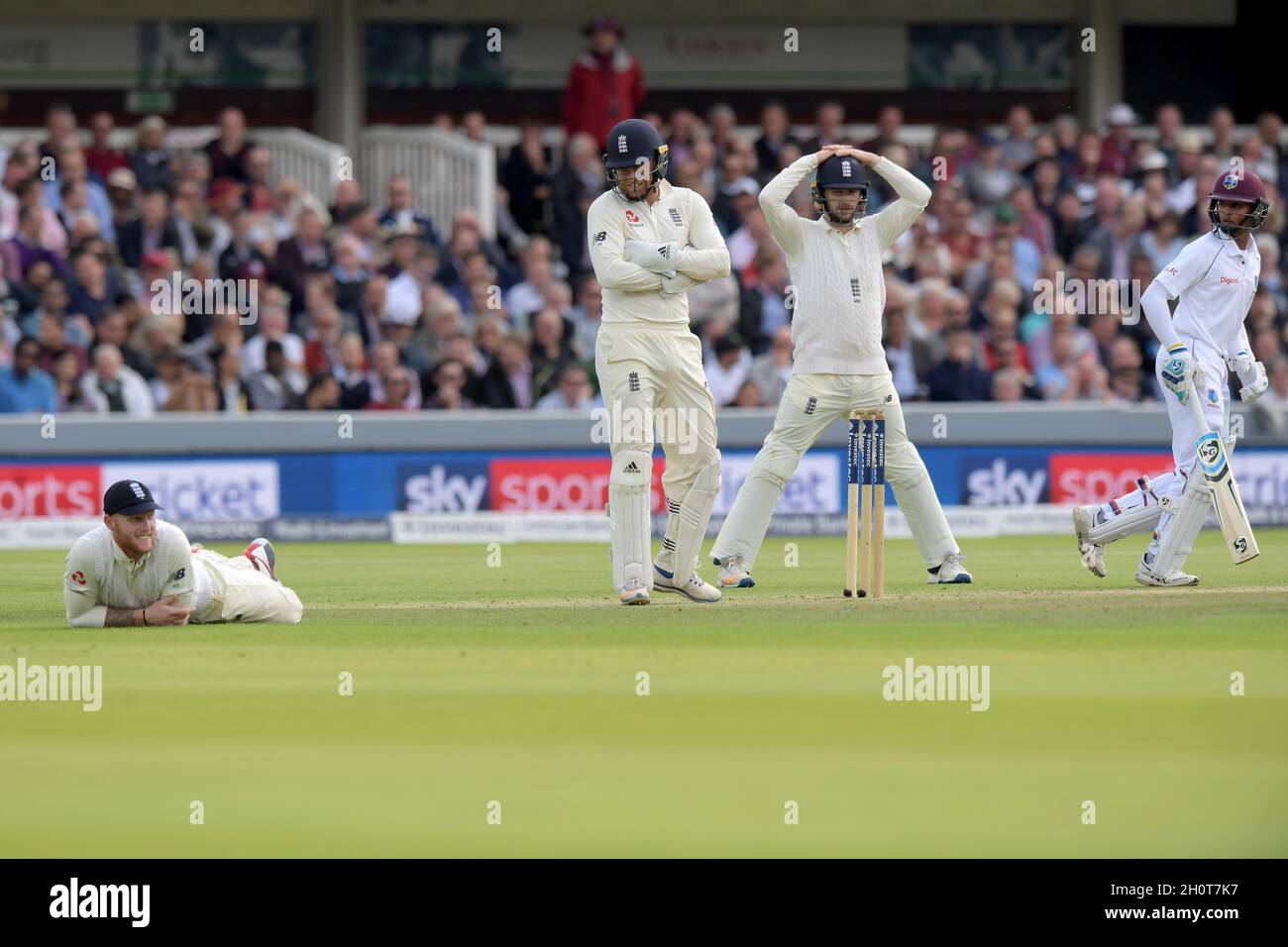 England"s Ben Stokes (left) looks-on after missing catch from West ...