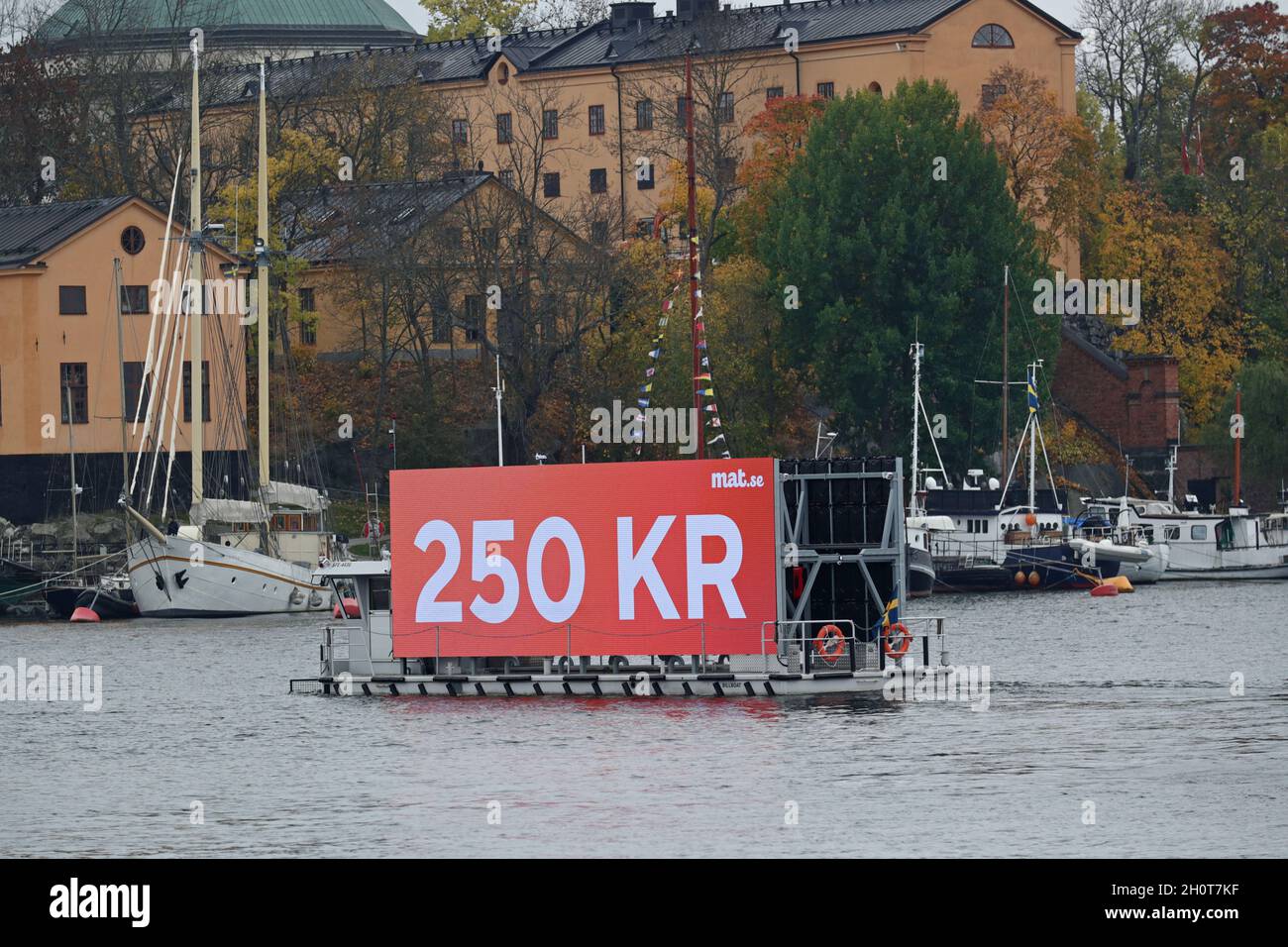 A floating advertising boat in central Stockholm, Sweden, during Sunday ...