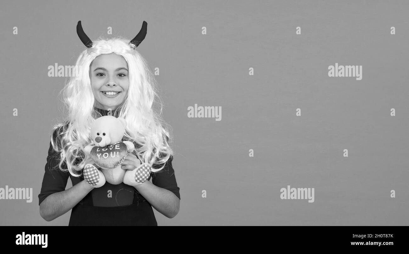childhood. happy halloween devil girl. teenage child in imp horns ...