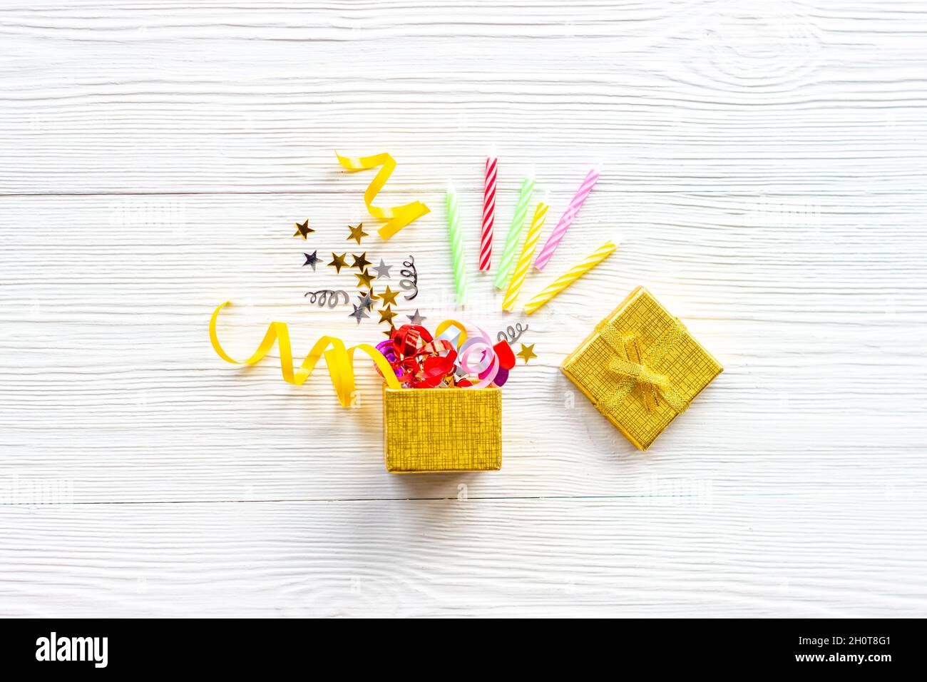 Party or birthday decoration flat lay with gift box Stock Photo - Alamy