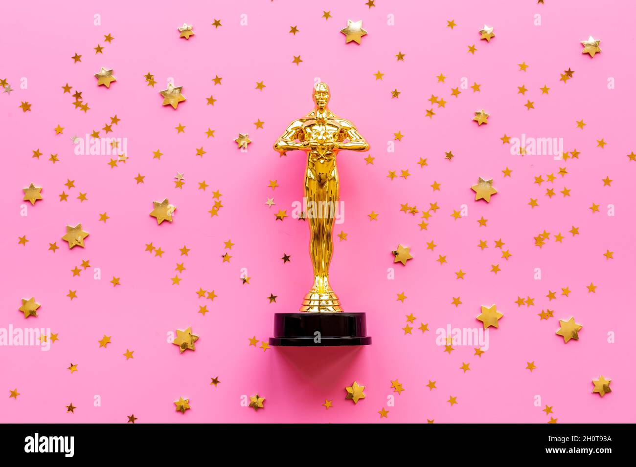 Golden film award statue - winner of movie industry Stock Photo - Alamy