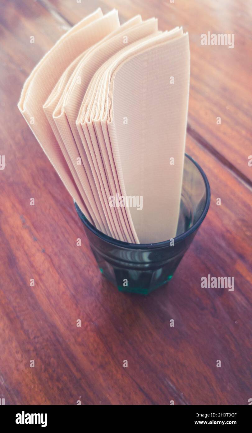 Tissue paper in cup put on the wood table. ready to use tissue paper ...