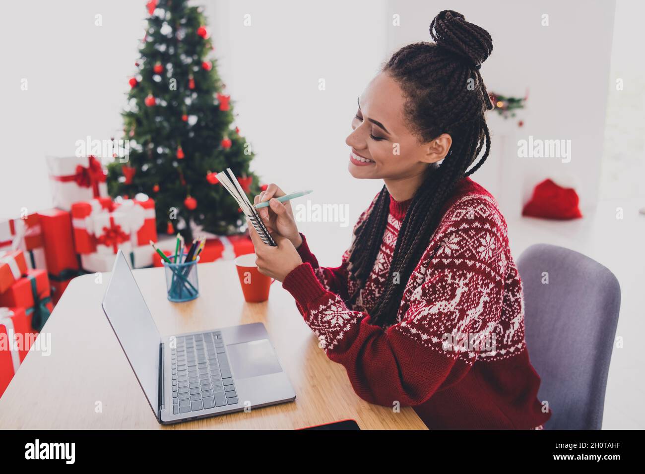 Profile side view portrait of attractive cheerful girl writing notes ...