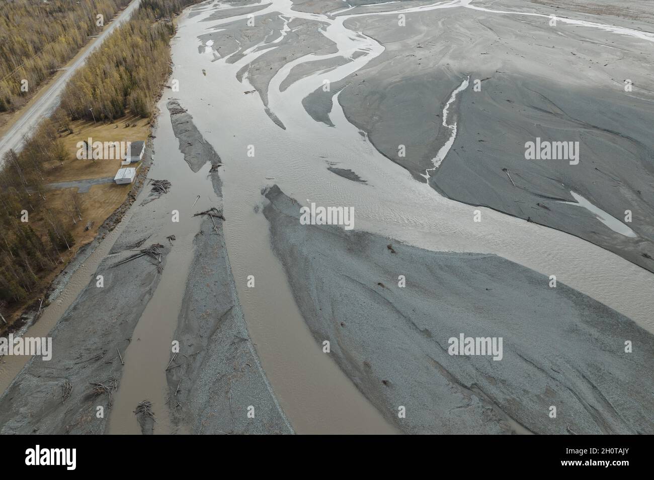 Aerial view of rivers with snowy mountains in the background Stock ...