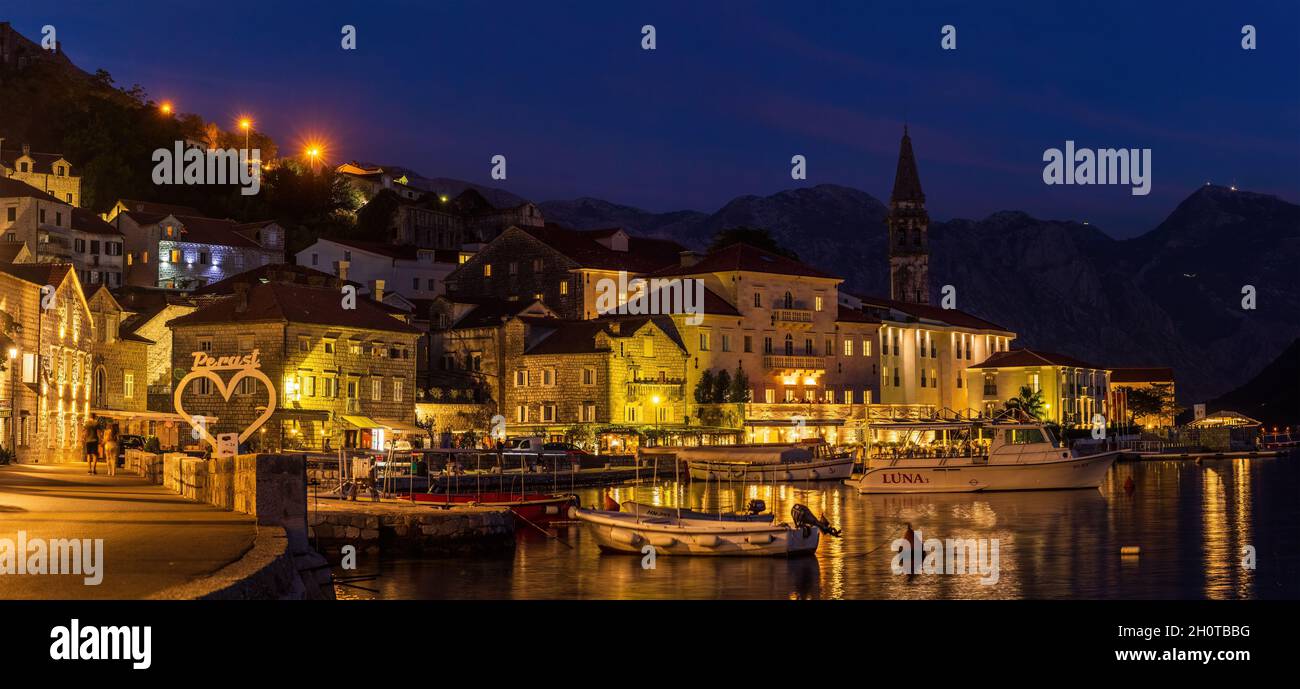 Sunset at the waterfront of the old town Perast in the Bay of Kotor in ...