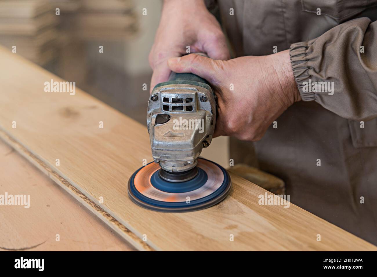 close up of carpenter's hand using a grinder on a wood surface Stock ...