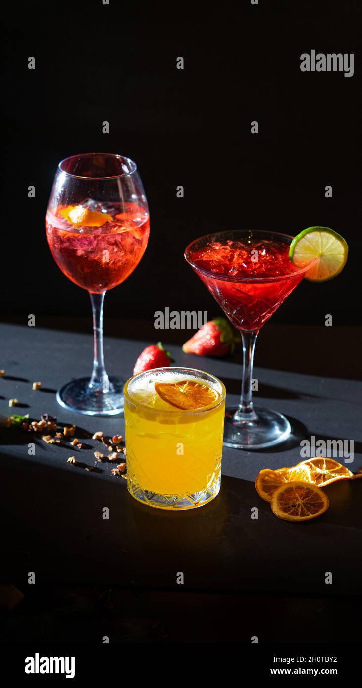 Aperol Spritz and red and yellow aperitif cocktails in glass with ice ...