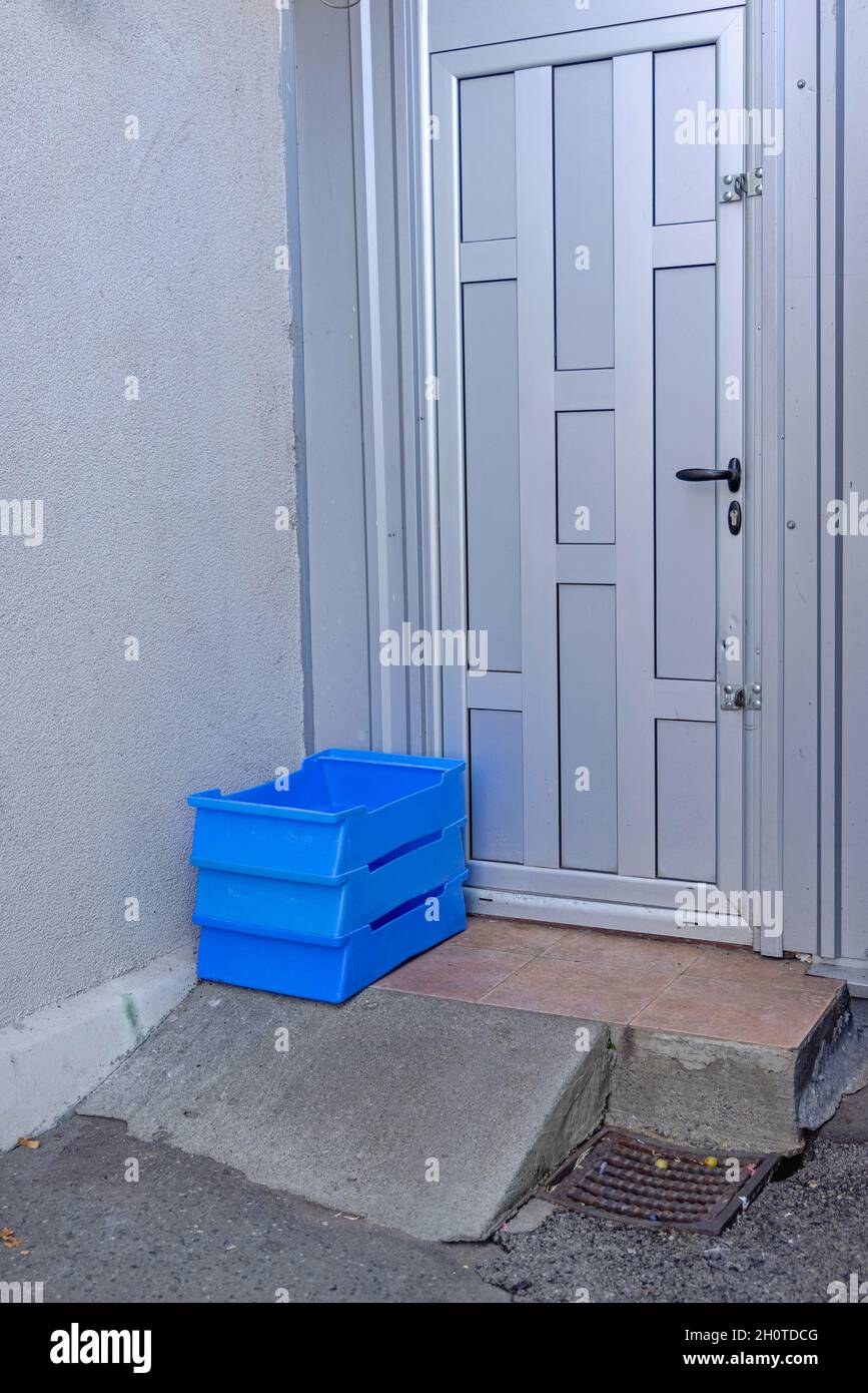 Stacked Milk Crates in Front of Shop Door Delivery Stock Photo - Alamy