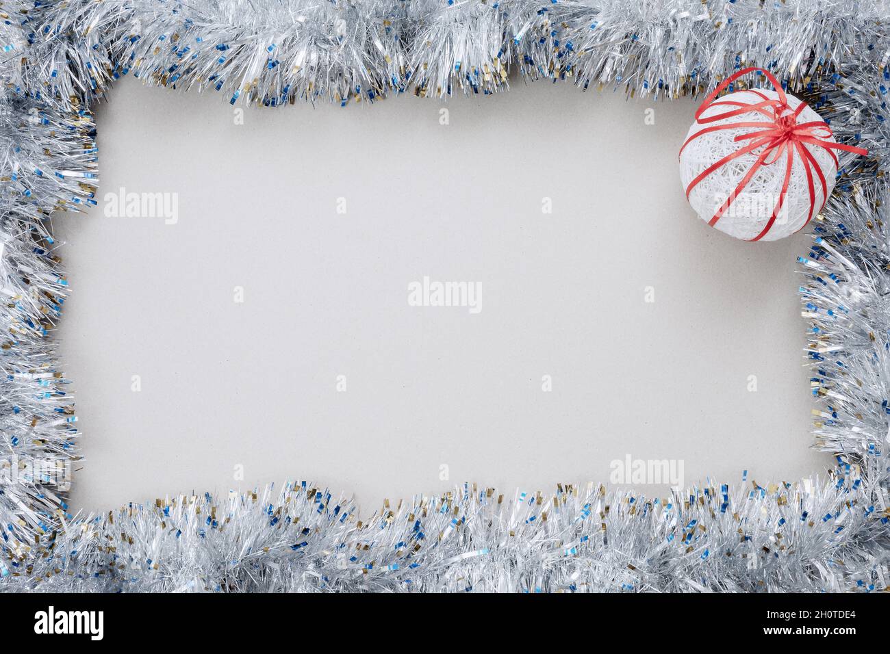 Shiny silver tinsel with a Christmas ball borders blank white ...