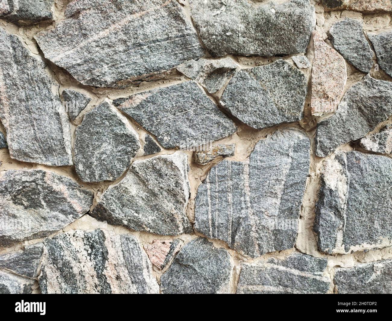 Rough texture of old granite stone wall Stock Photo - Alamy