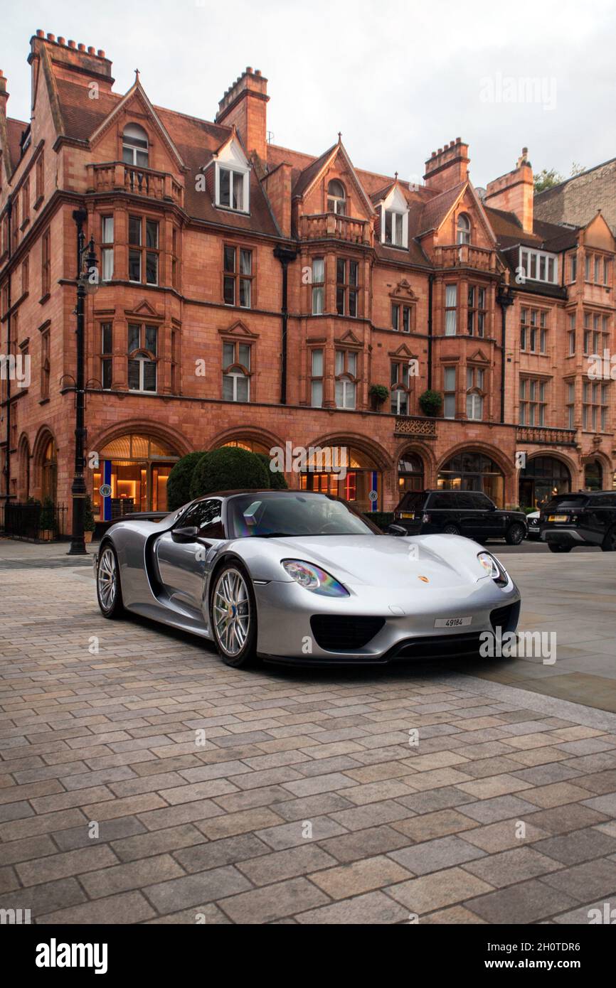 Silver Porsche 918 Spyder Weissach Package supercar parked at a luxury ...