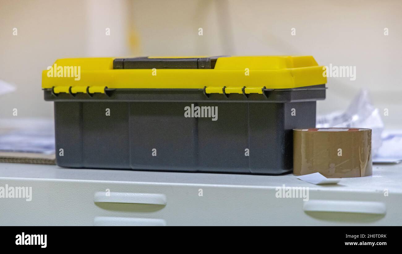 Small Plastic Tool Box and Packing Tape Stock Photo - Alamy
