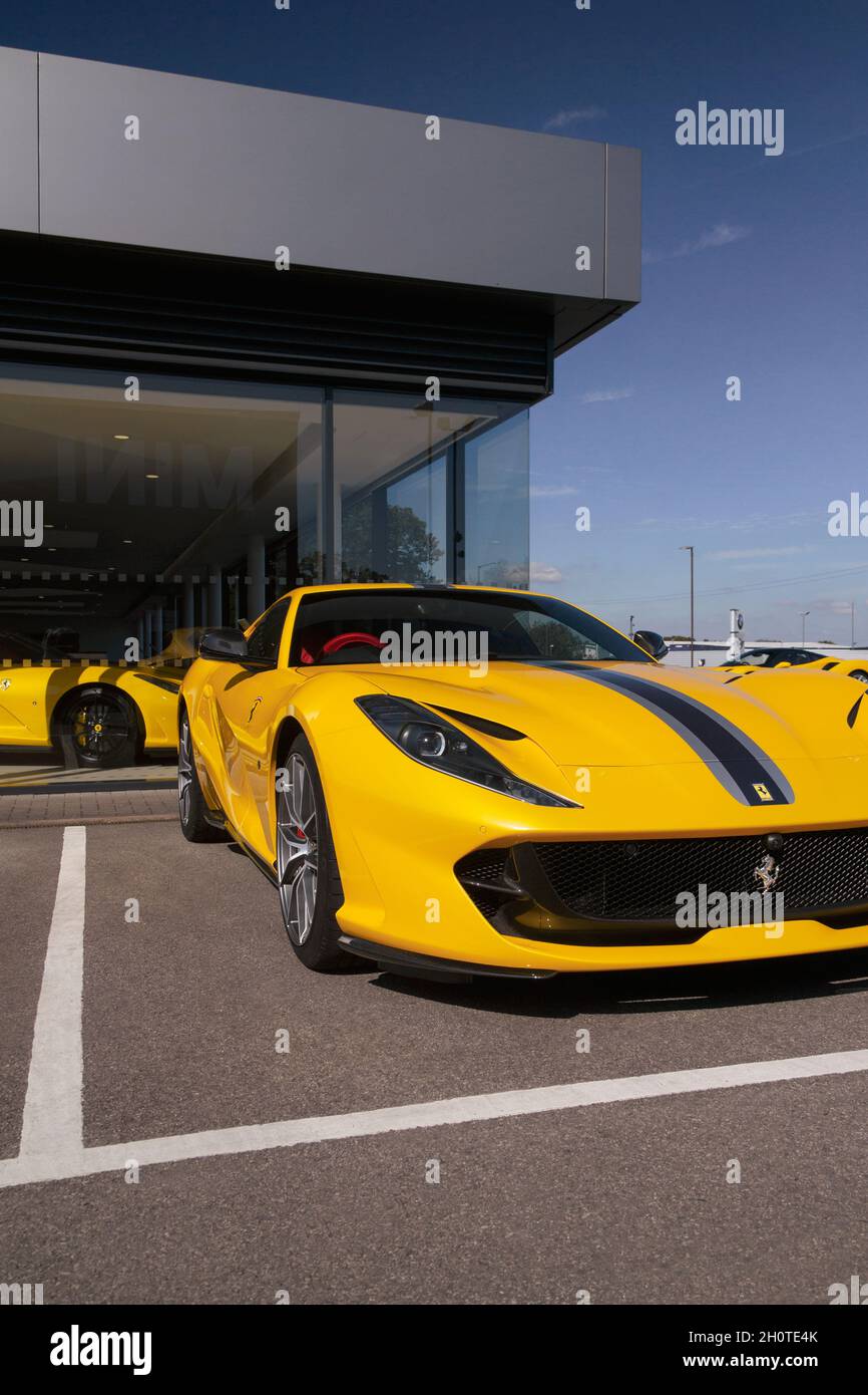 Yellow with blue stripe Ferrari 812 Superfast supercar parked at a ...