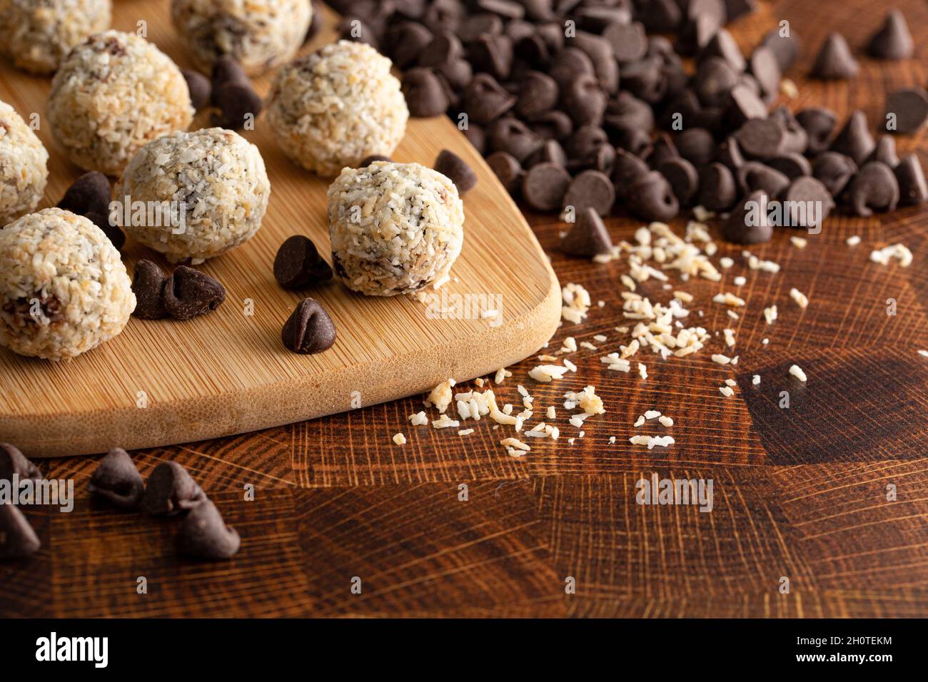 Coconut Chocolate Energy Balls on Wooden Butcher Block Stock Photo - Alamy