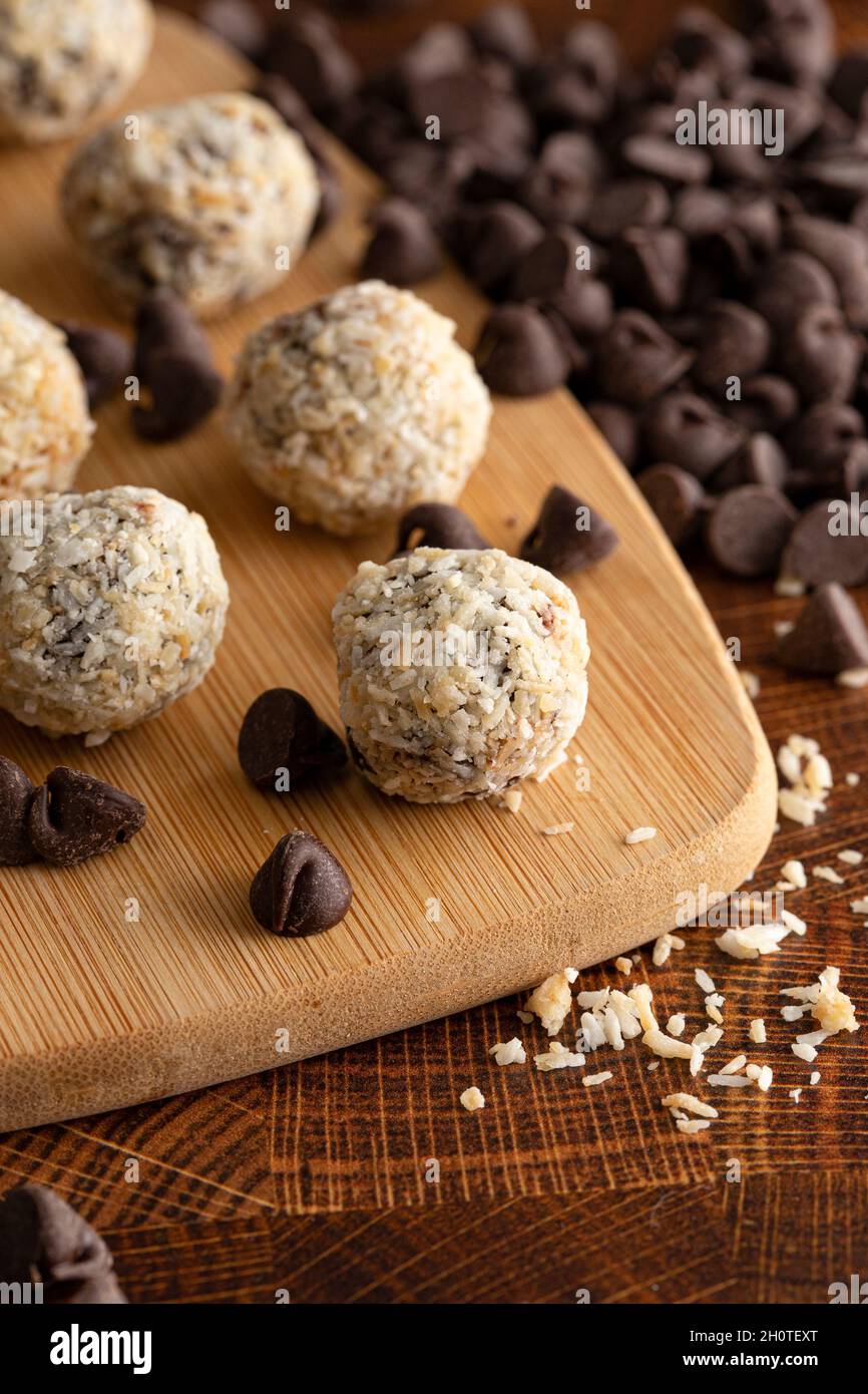Coconut Chocolate Energy Balls on Wooden Butcher Block Stock Photo - Alamy