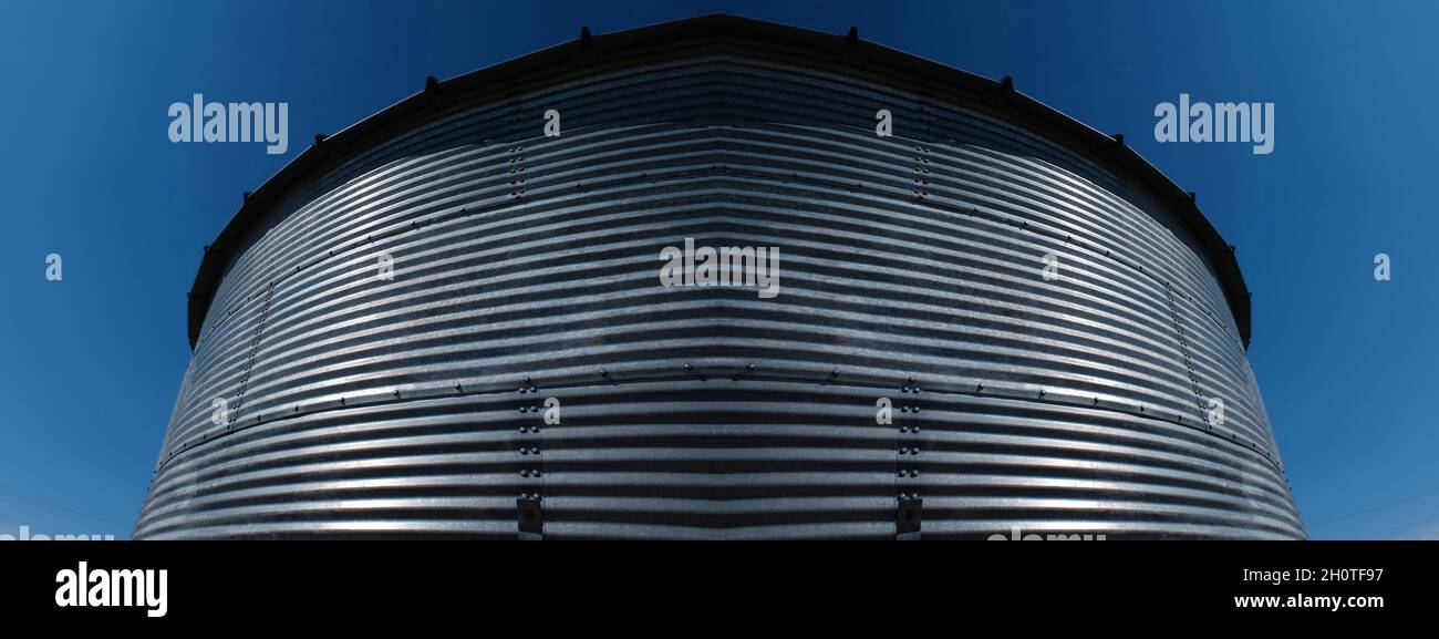 Grain Granary Silo on farm holding crops with blue sky Stock Photo - Alamy