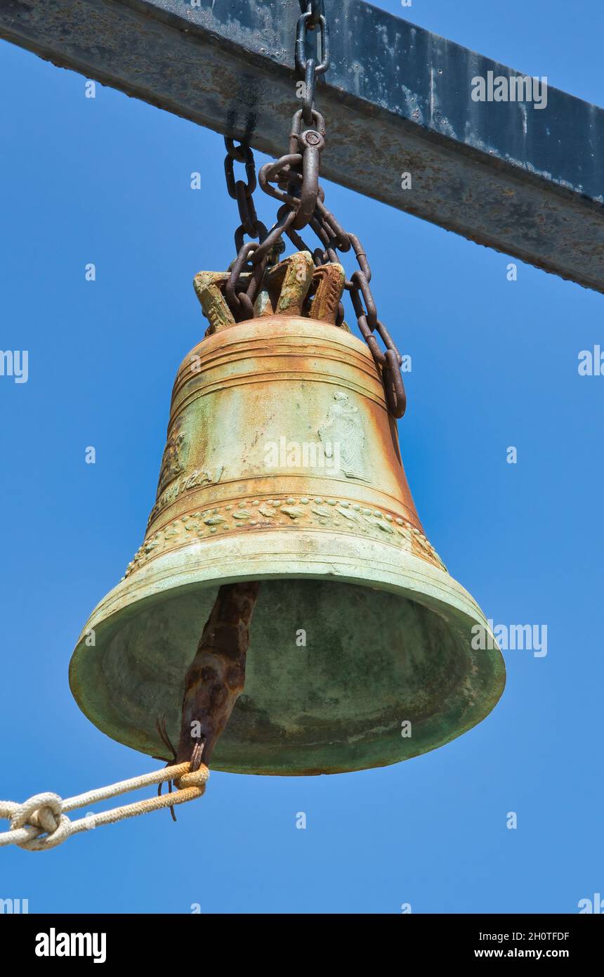 Closeup of an old rusty church bell in the blue sky background Stock ...