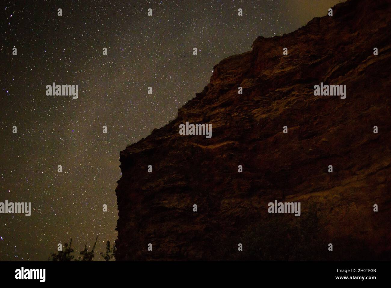 Scenic view of a rocky cliff on a night sky background Stock Photo - Alamy