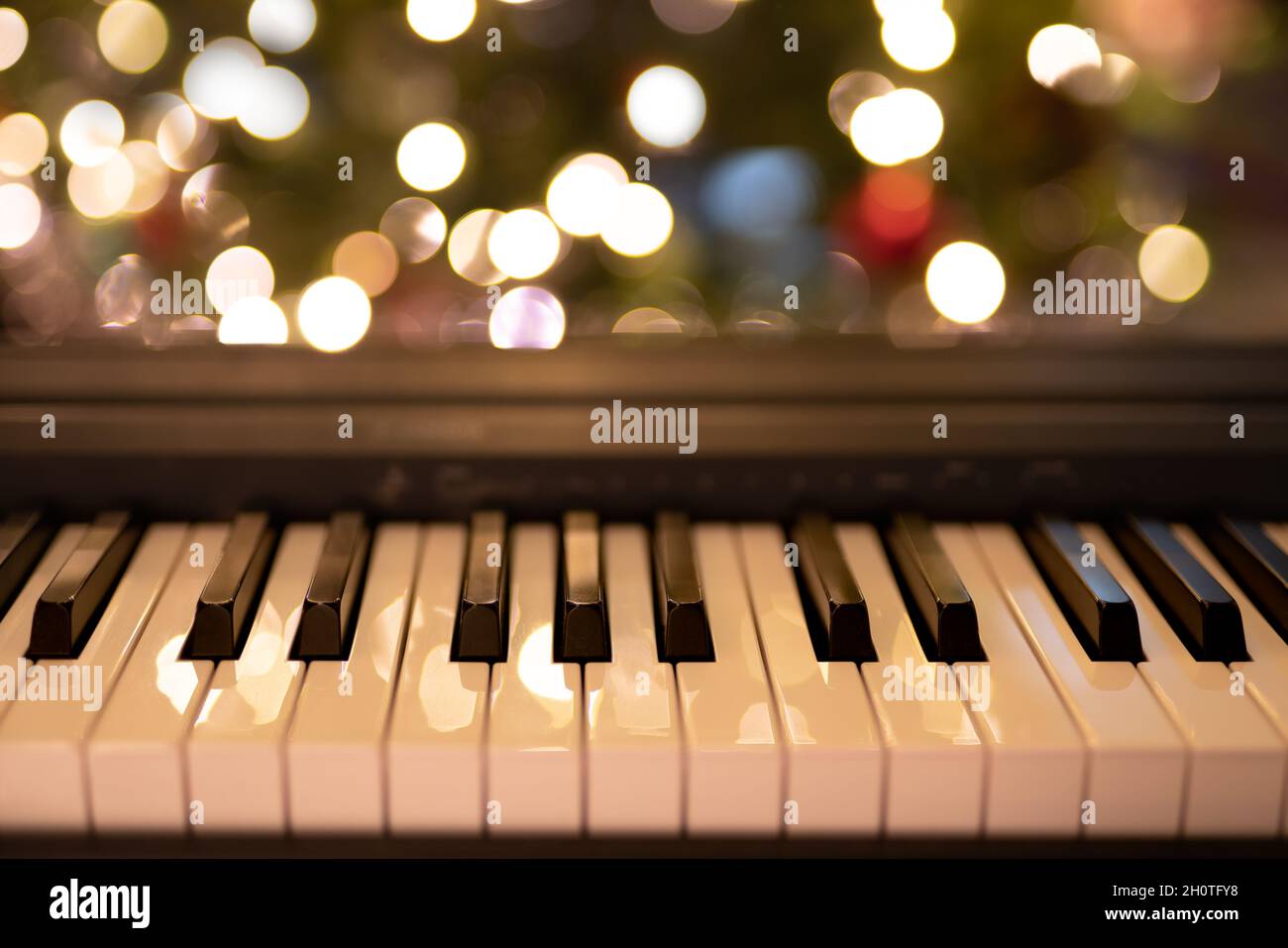 Christmas illuminations and piano keyboard. Holidays, Happy New Year ...