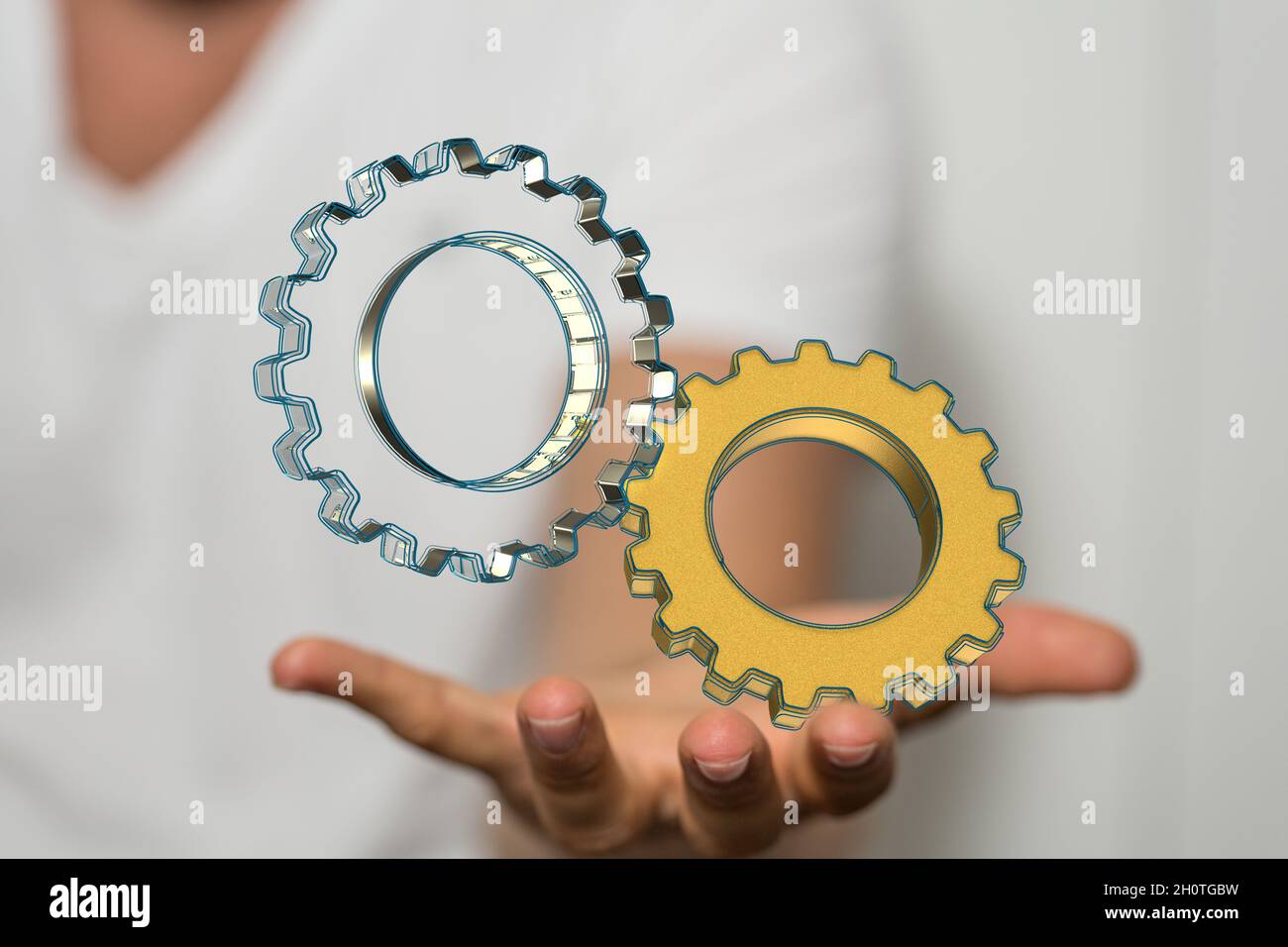 3D rendering of floating gears on a man's hand - engineering concept ...