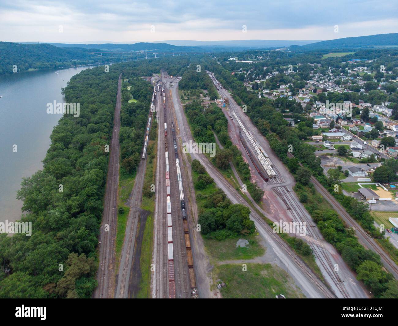 Aerial shot of a beautiful view in a natural place, railway train and a ...