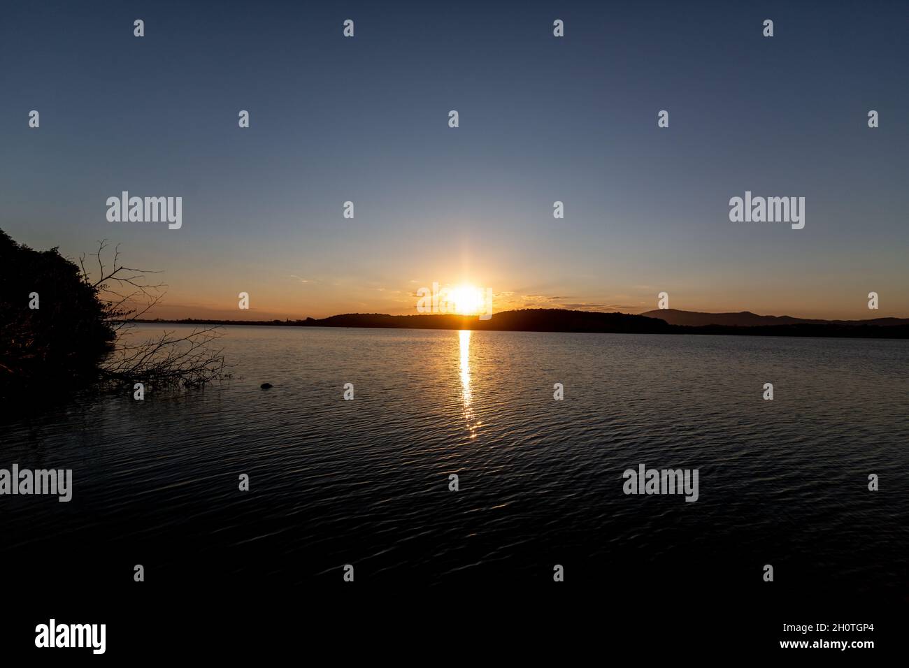 Beautiful sunrise over a lake Stock Photo - Alamy
