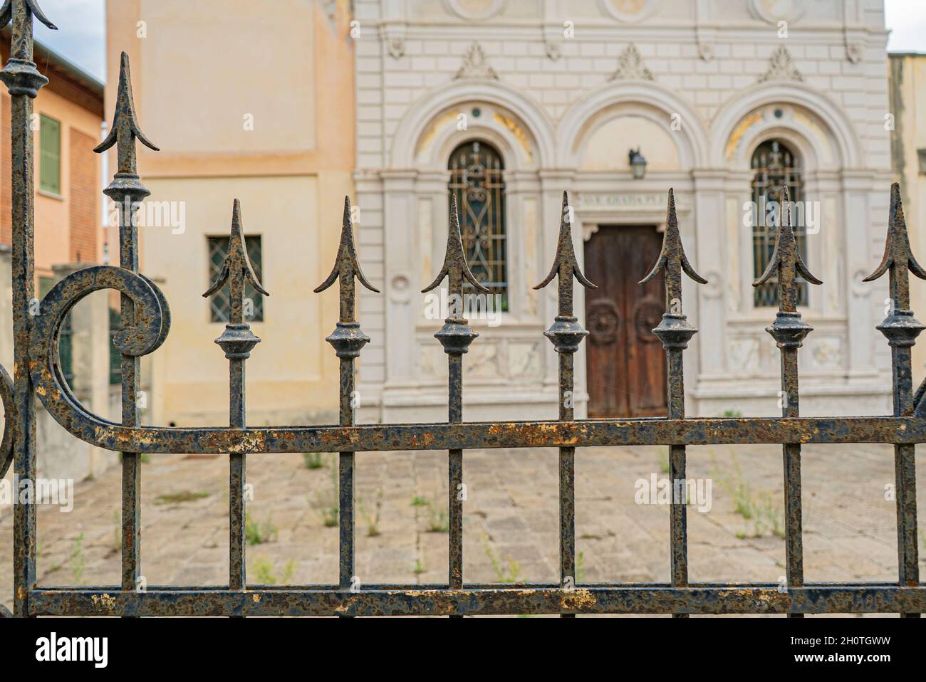 Wrought iron gate spikes detail in an ancient building in Italy Stock ...