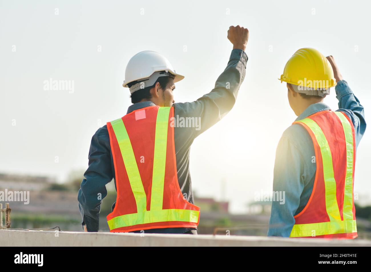 Teamwork Engineer working work hard on site construction Stock Photo ...