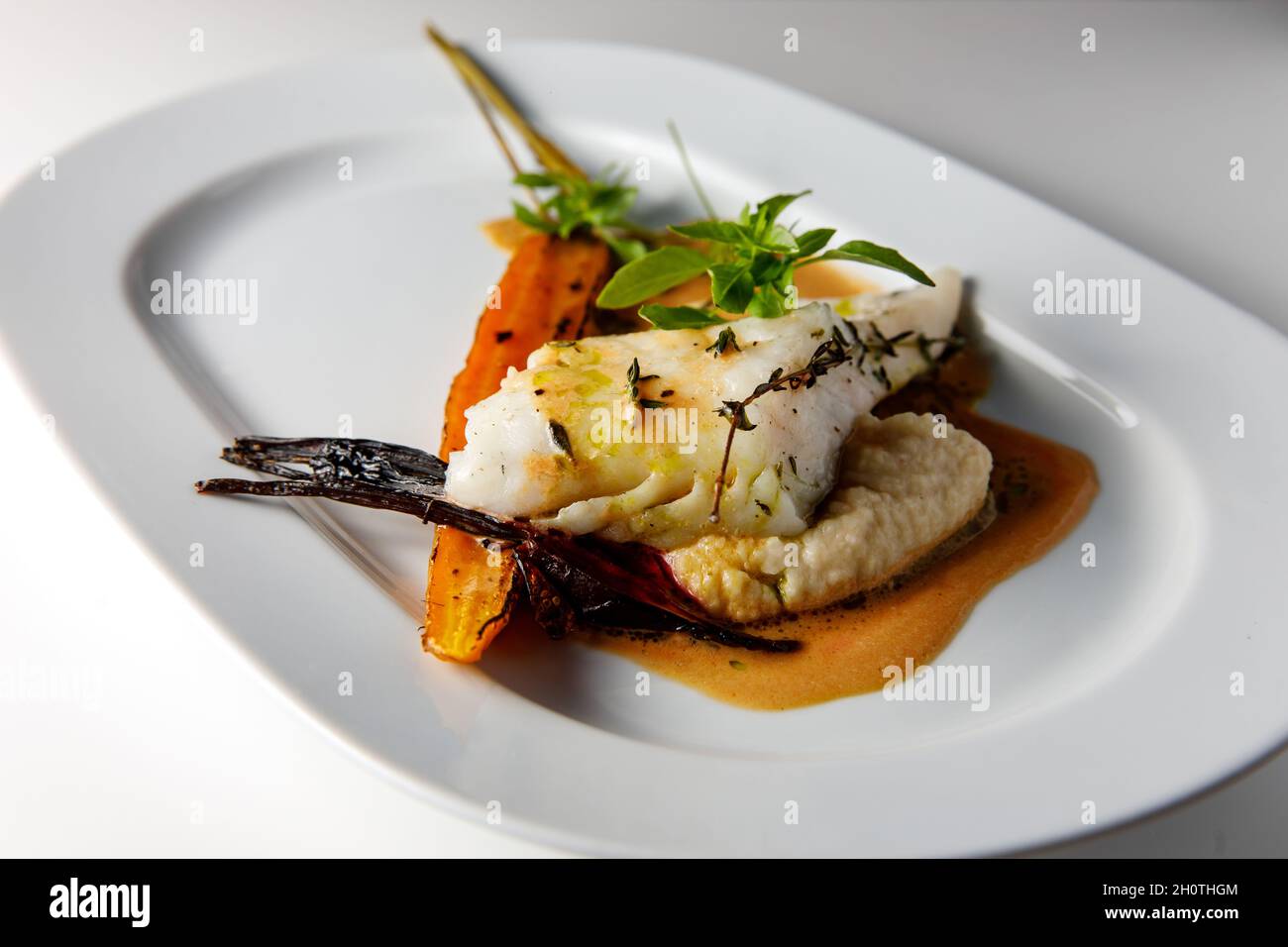 Fish dish - fried fish fillet of zander Stock Photo - Alamy
