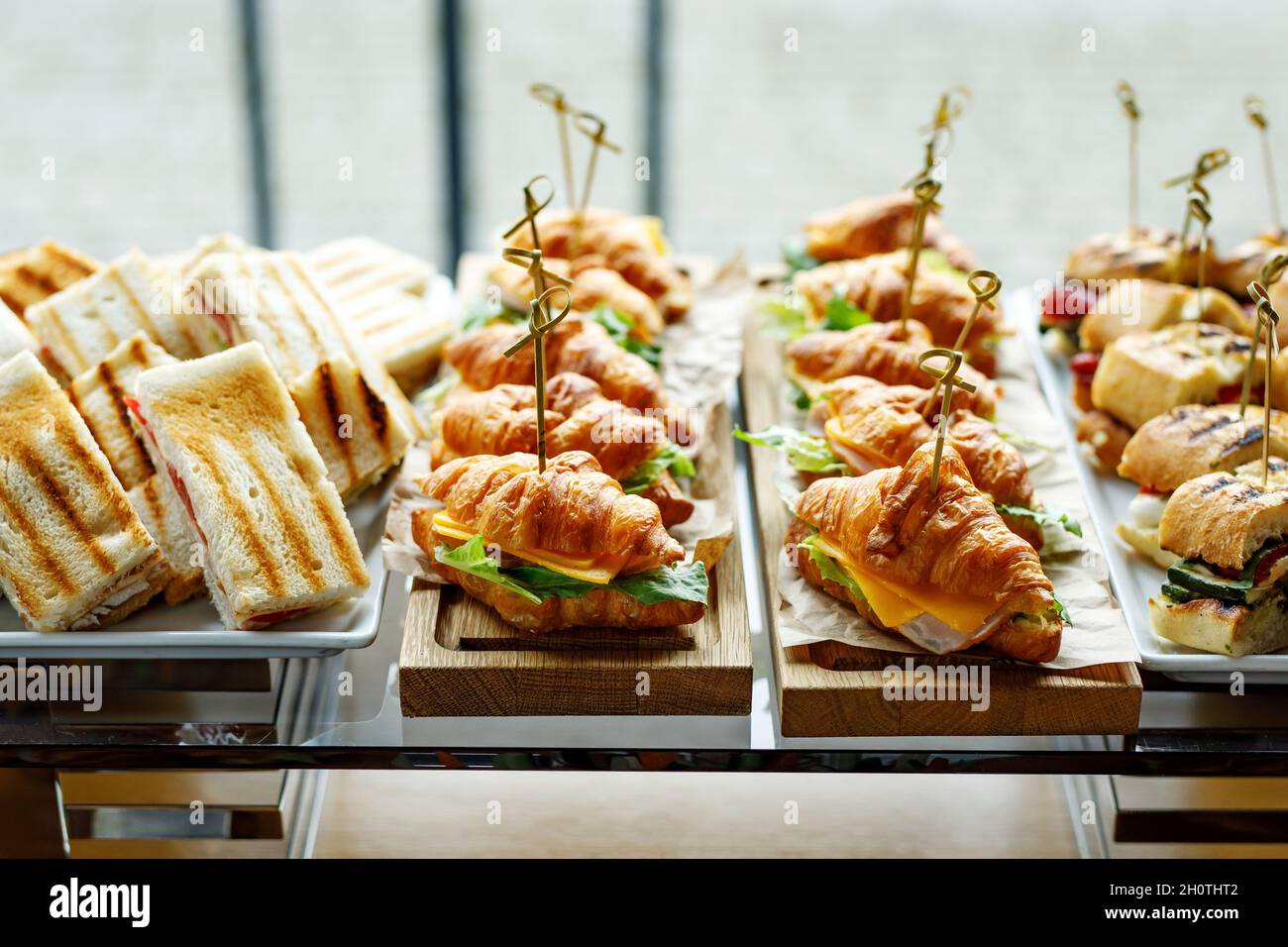 Stacks of croissant sandwich at event Stock Photo - Alamy