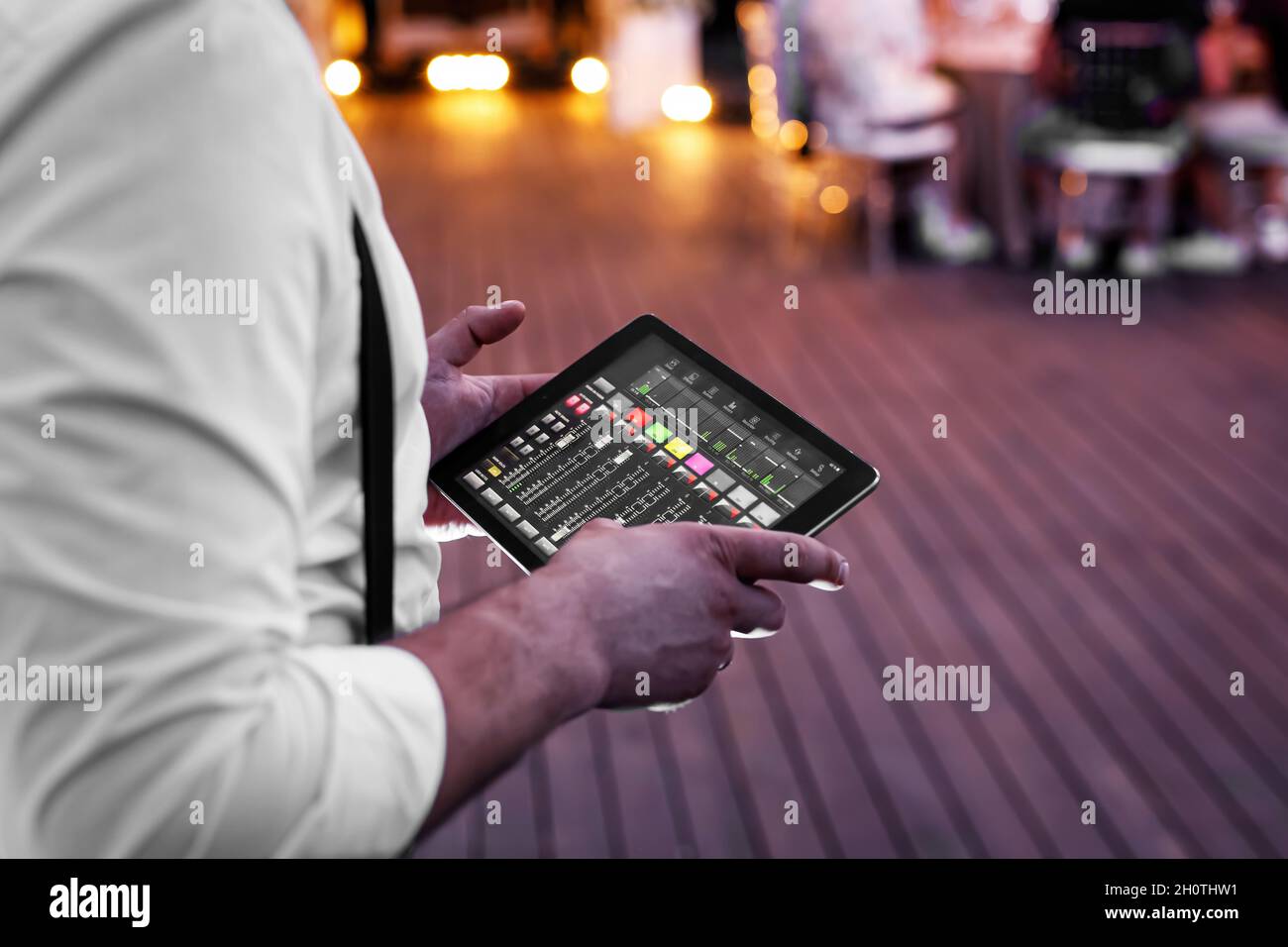 Sound manager with tablet at event Stock Photo - Alamy