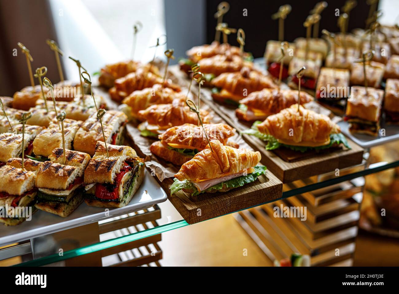 Stacks of croissant sandwich at event Stock Photo - Alamy