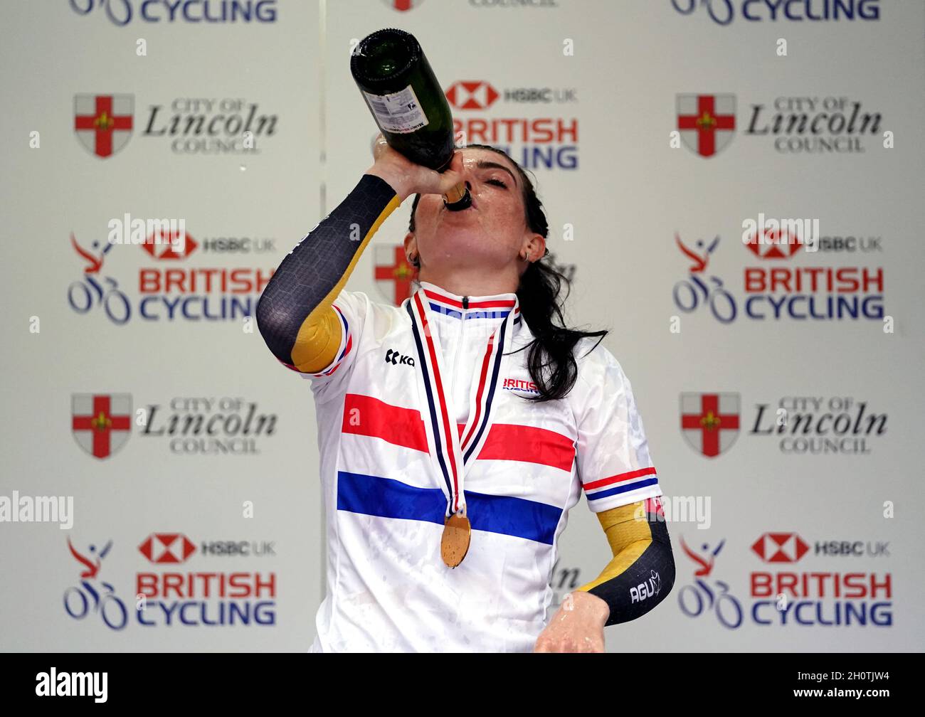 Anna Henderson of team Jumbo-Visma celebrates first place on the podium ...