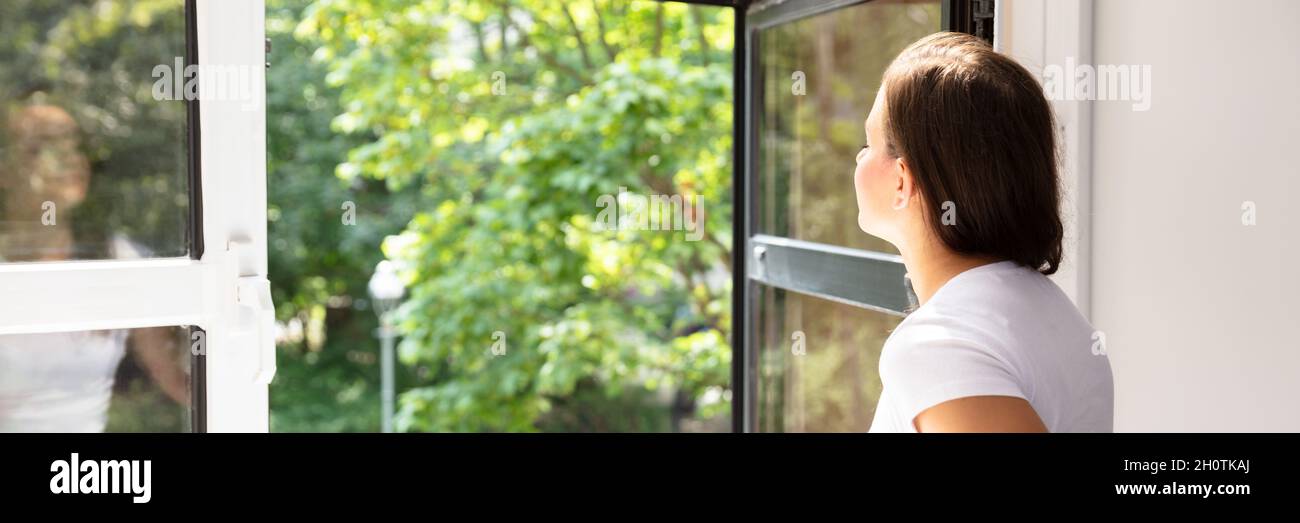 Fresh Air From Window. Side View Of Woman Breathing Stock Photo - Alamy