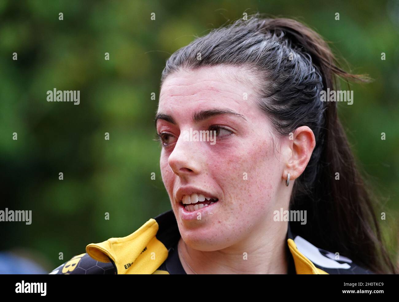 Anna Henderson of team Jumbo-Visma reacts after finishing first after ...
