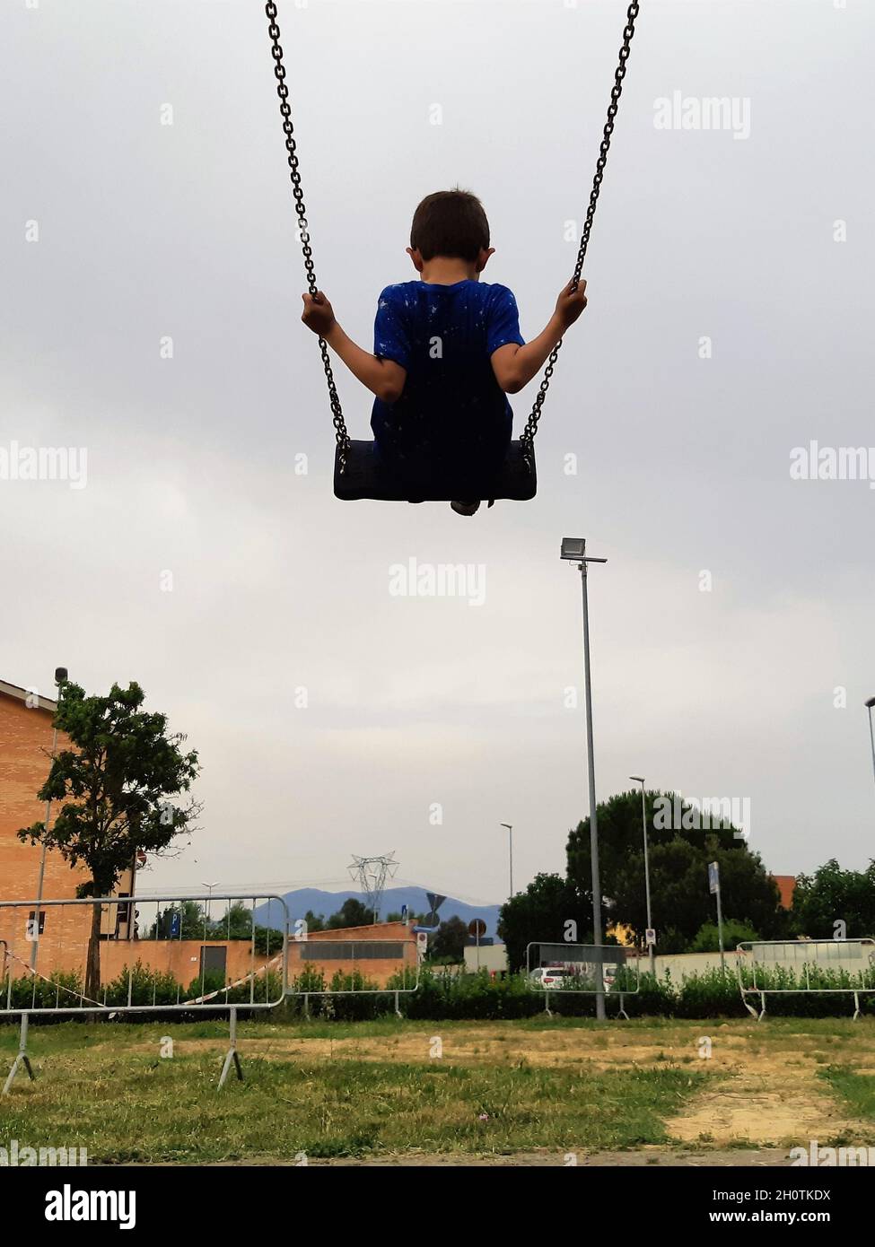 Child on swing her view hi-res stock photography and images - Alamy