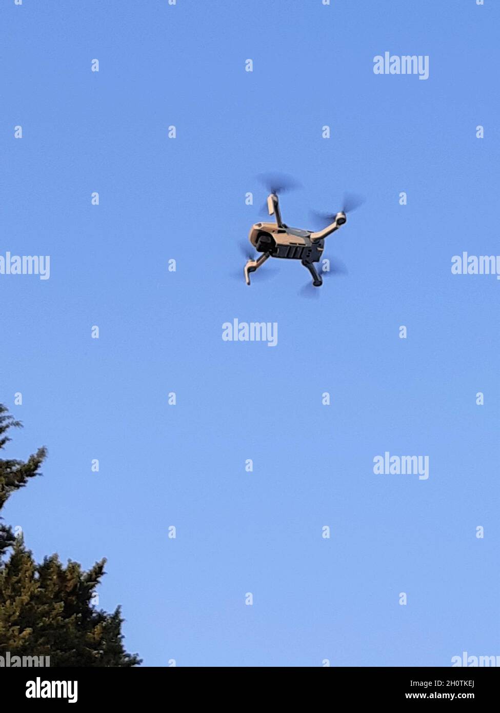 Drone flying high in the sky Stock Photo - Alamy