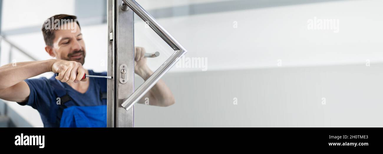 Locksmith Man Changing And Fixing Door Lock Stock Photo - Alamy