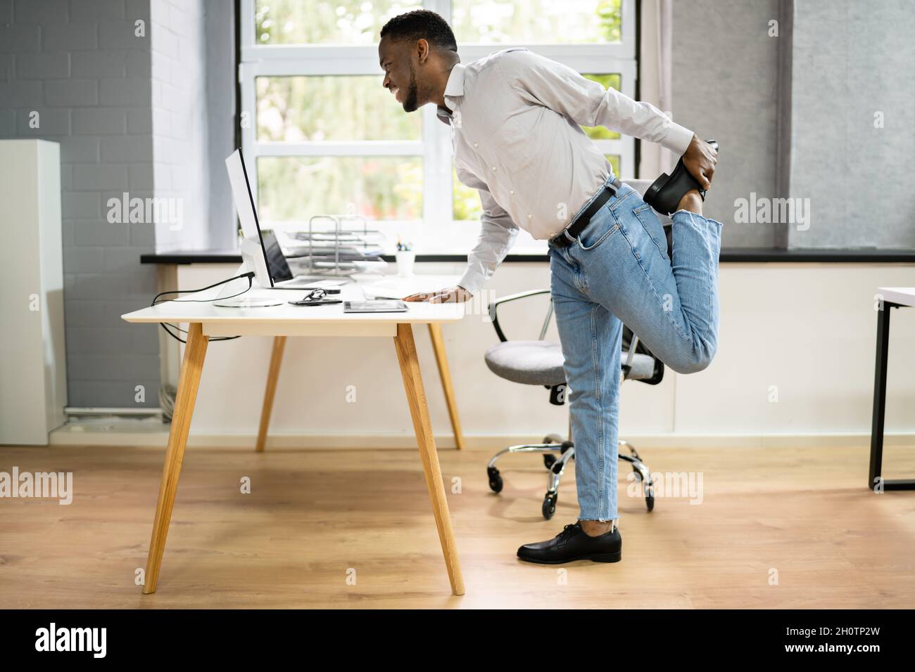 African American Male Exercise Office. Stretching Workout Stock Photo ...