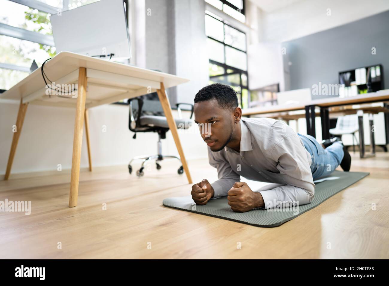 African American Doing Office Exercise Workout Training Stock Photo - Alamy